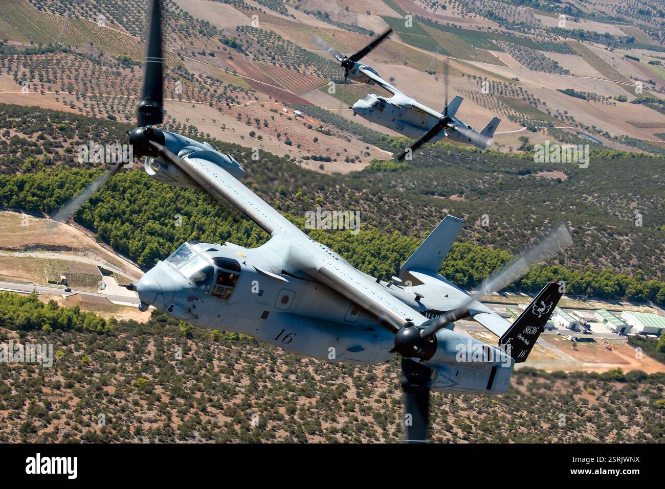 US Marines OV-22 Osprey performing a tactical mission. Vertical takeoff ...
