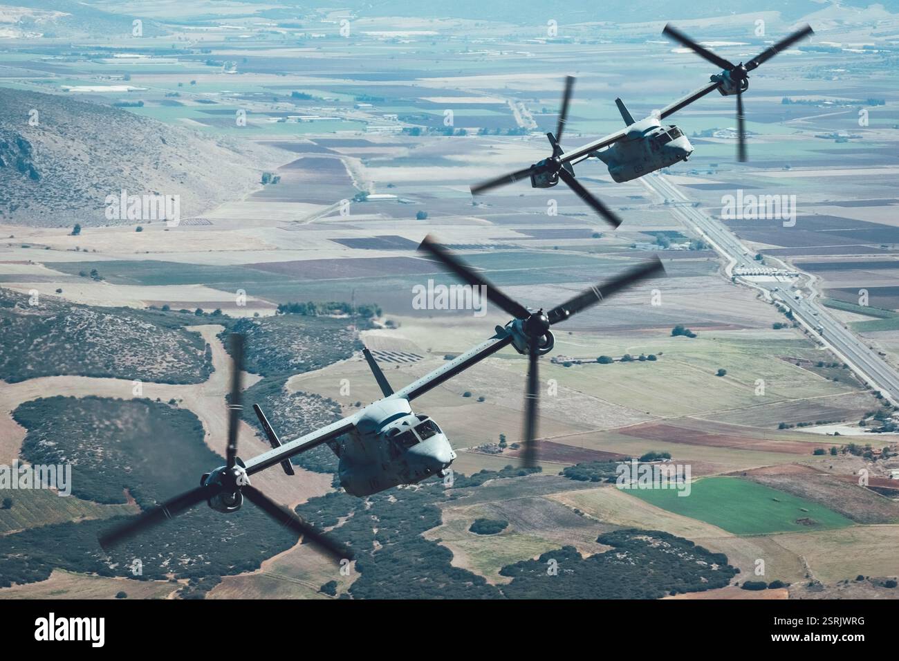 US Marines OV-22 Osprey in training. Tilt-rotor aircraft performing ...