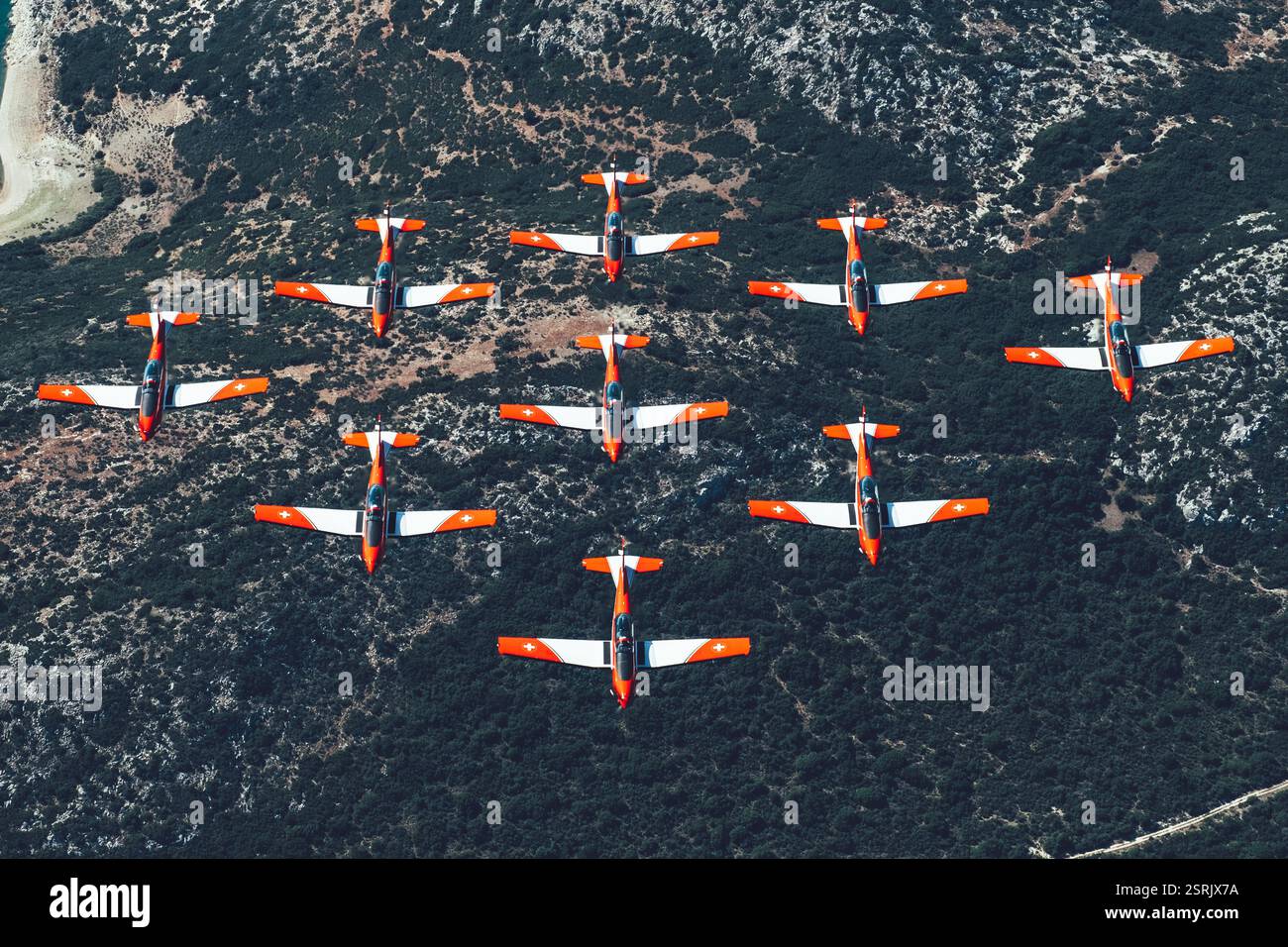 Swiss Air Force PC-7 Team executing synchronized formations in Pilatus PC-7 trainers ...