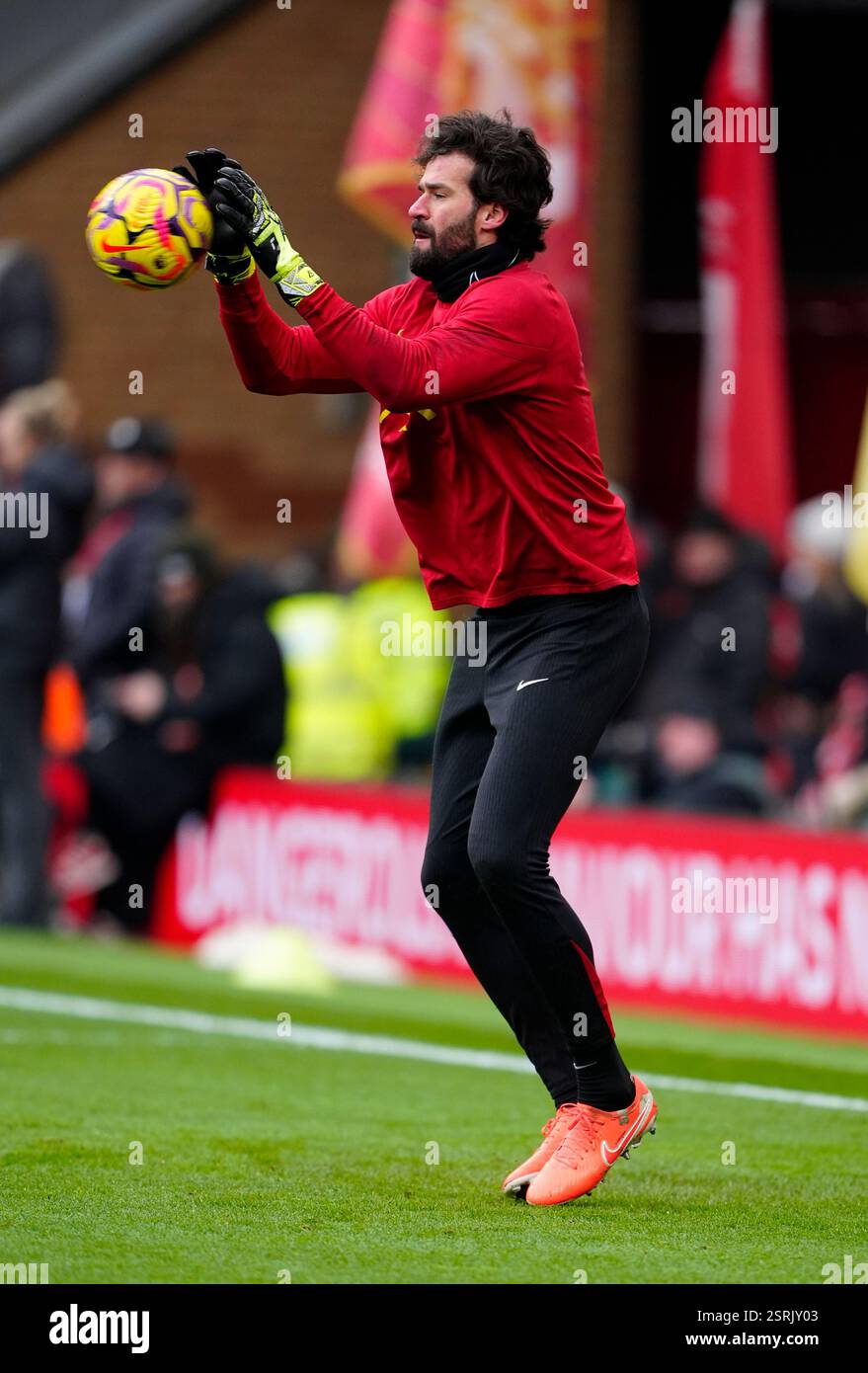 Liverpool goalkeeper Alisson Becker warms up before the Premier League ...