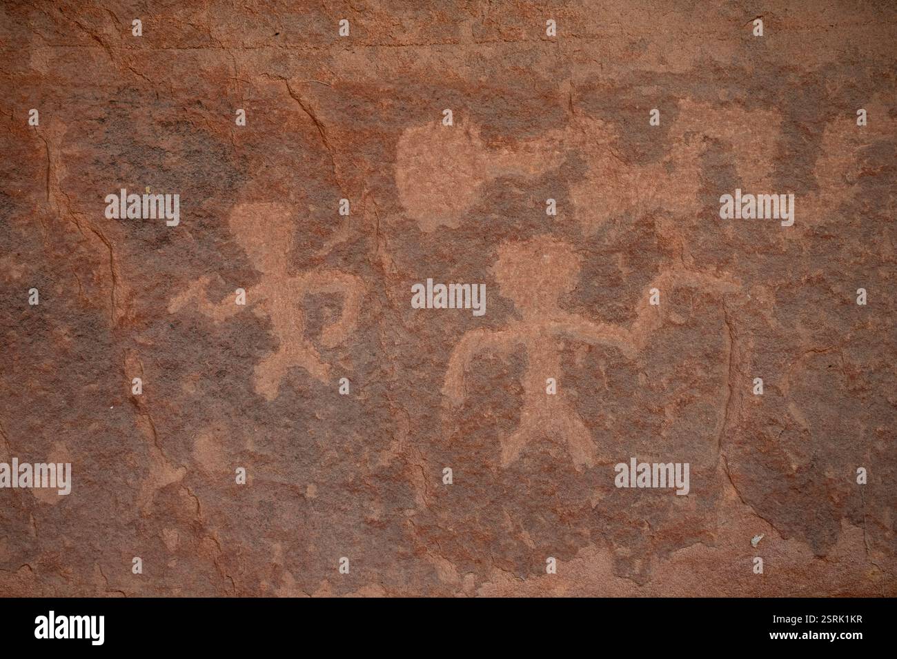 Petroglyphs of human figures on sandstone rock face, Zion National Park ...