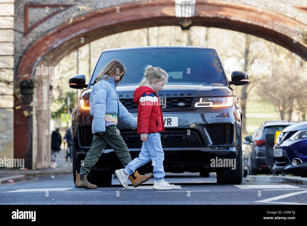 Danger to children from sports utility vehicles Stock Photo - Alamy