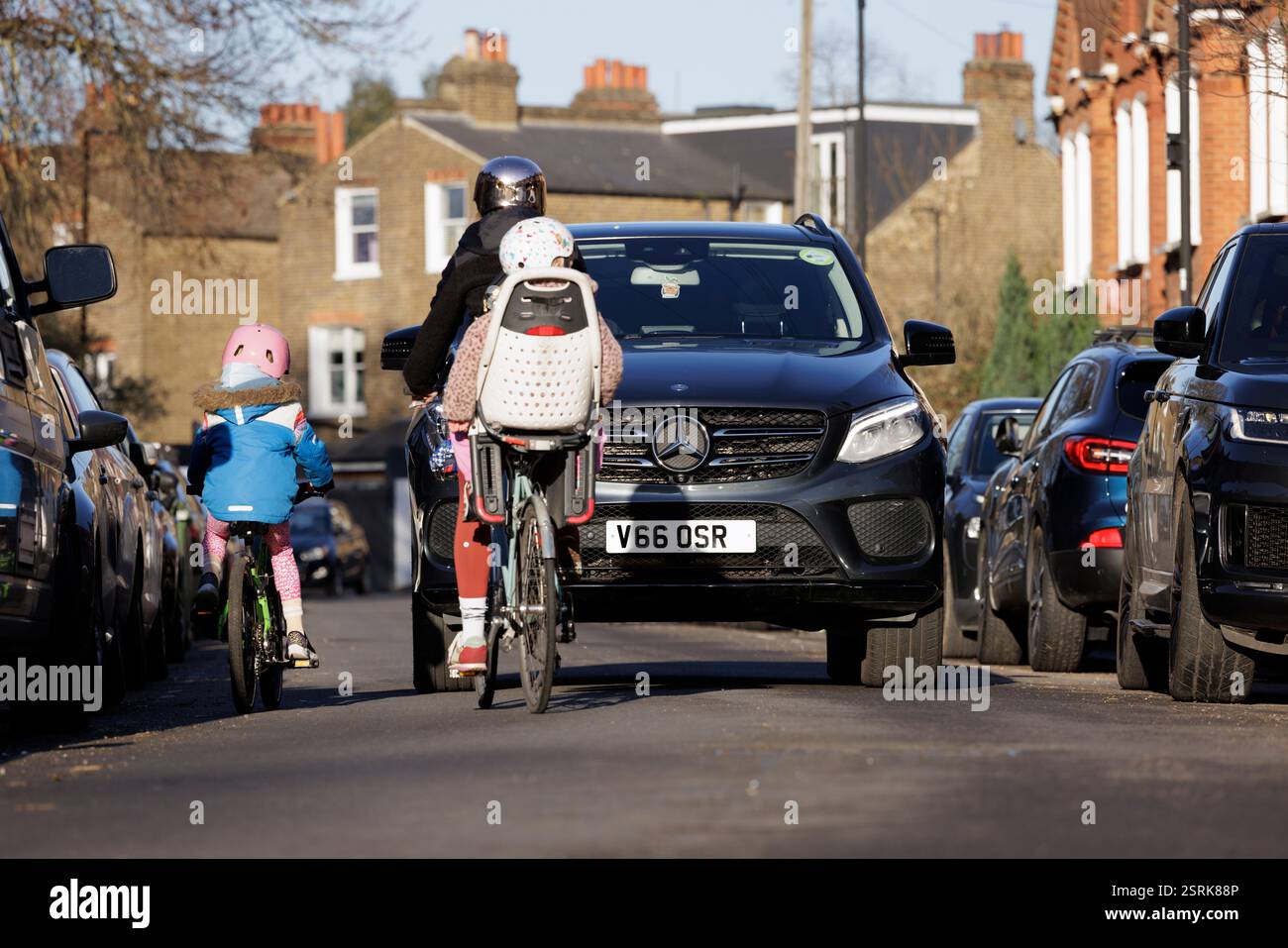 Danger to children from sports utility vehicles Stock Photo - Alamy