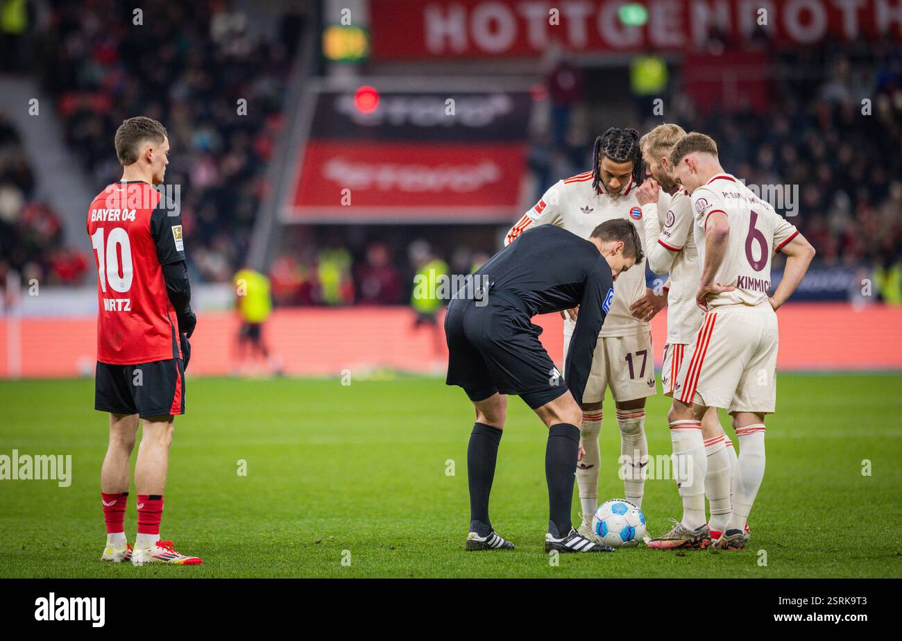 Leverkusen, Germany. 15th Feb 2025. Florian Wirtz (LEV) Michael Olise (FCB) Konrad Laimer (FCB ...