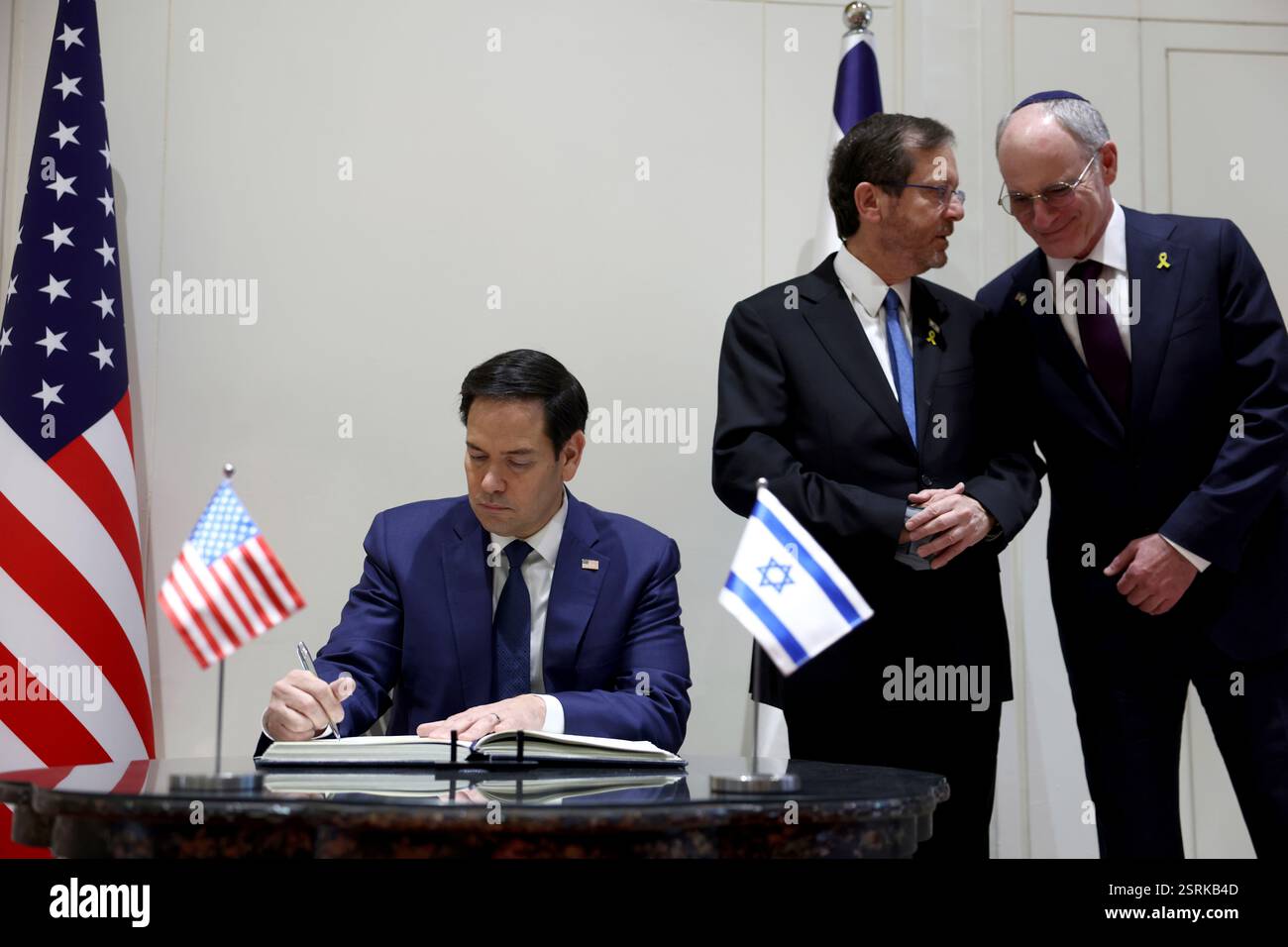 U.S. Secretary of State Marco Rubio signs the guest book during his ...