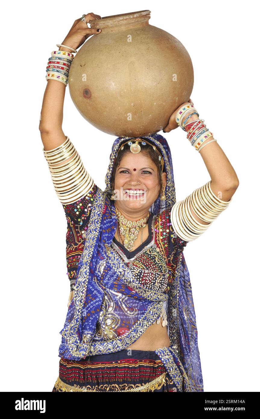 Rajasthani lady carrying earthen pitcher on head MR#786 Stock Photo - Alamy