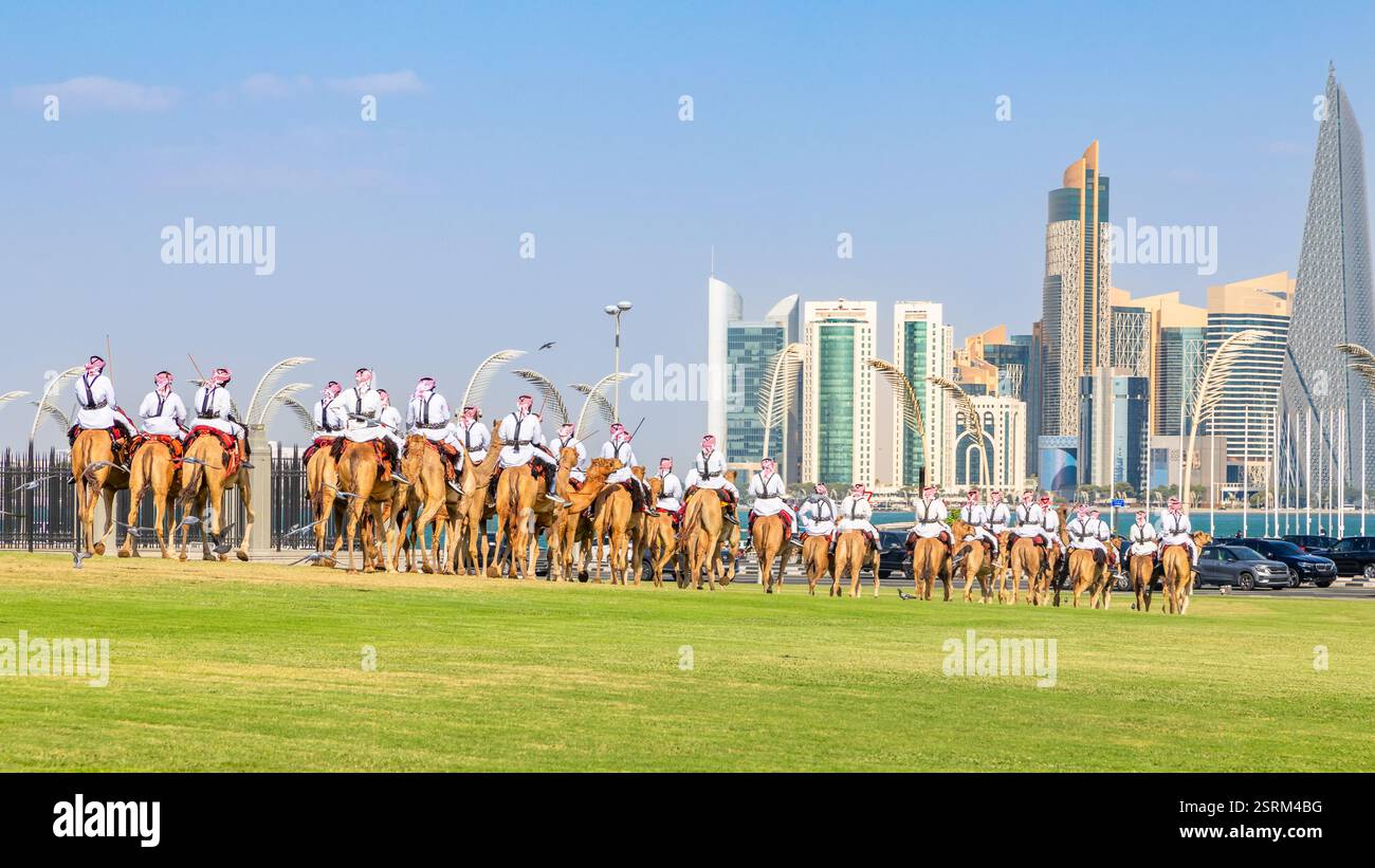 Royal camel guards parade against Doha futuristic business downtown ...