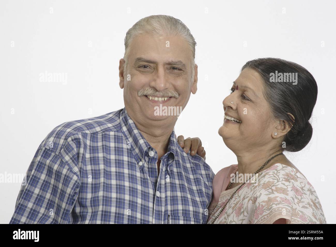 Old couple, lady kept right hand on shoulder looking at man and smiling ...