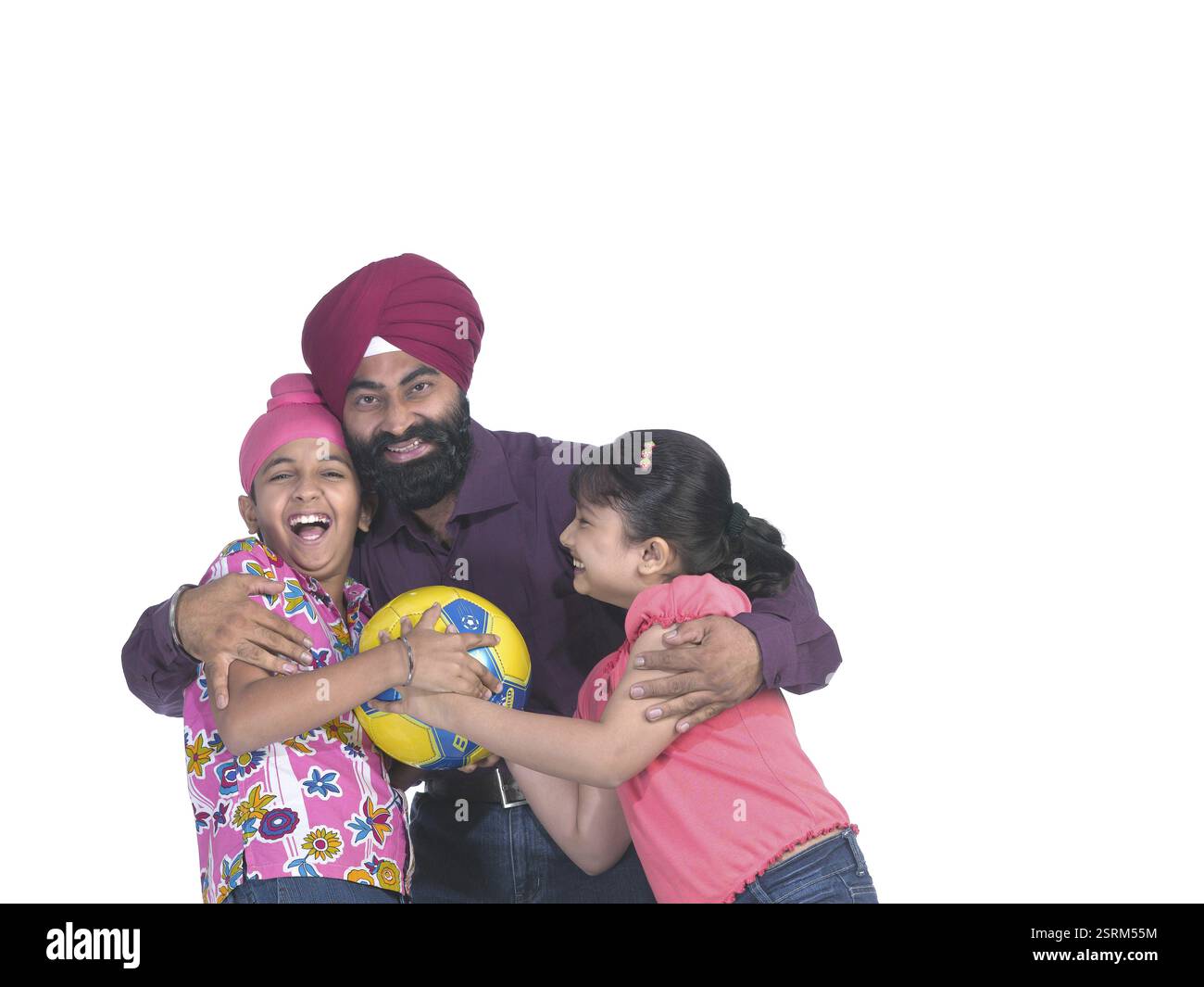 Sikh father with children playing with ball MR#702X, 702Y, 779A Stock ...