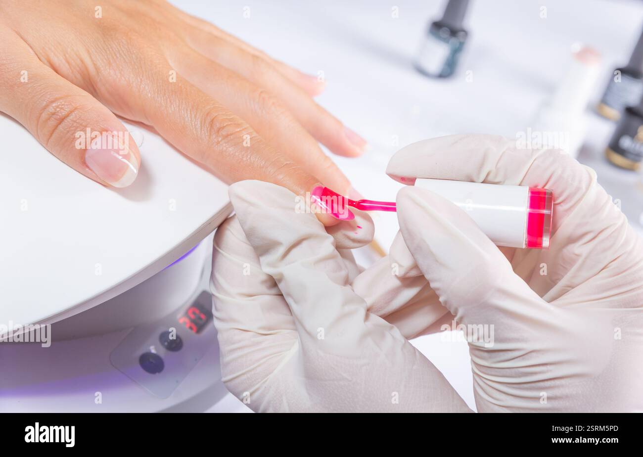 Professional manicurist woman works hi-res stock photography and images ...