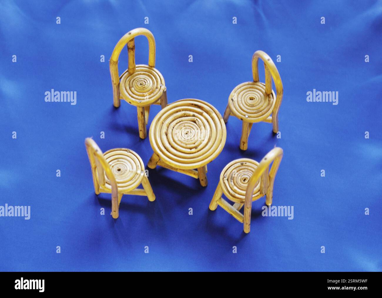 Dot of Dot Com, handicraft cane chair table on blue background Stock ...