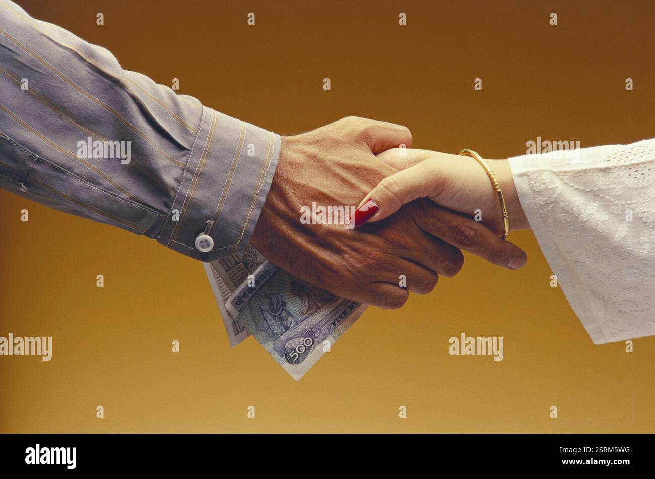 Concept, bribe hand shake Stock Photo - Alamy