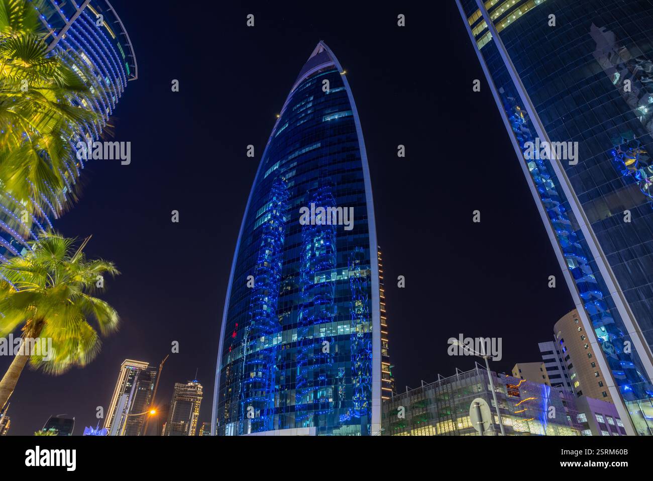Doha city business downtown center illuminated at night, with modern ...