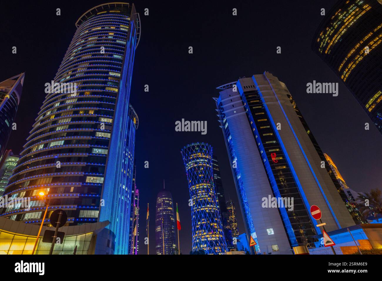 Doha city business downtown center illuminated at night, with modern ...
