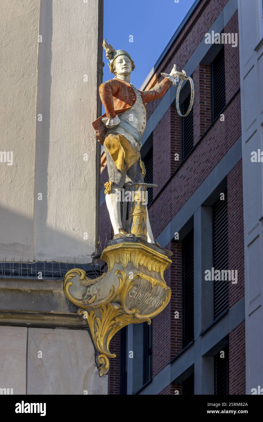 Life-size statue of a man in traditional traditional costume on the ...