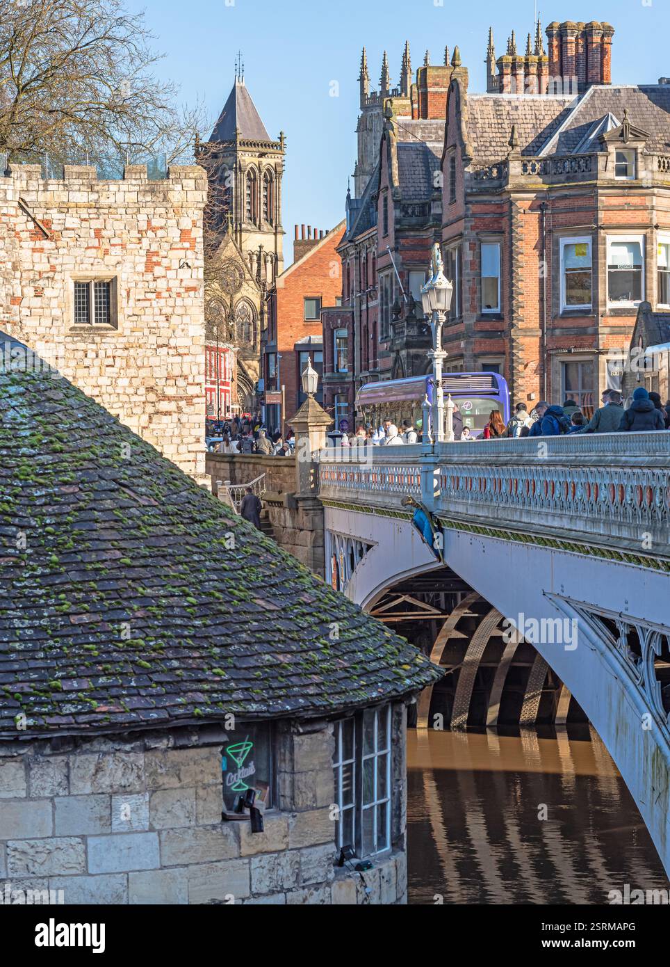 A view of a historic bridge with ornate lamps. An ancient building with ...