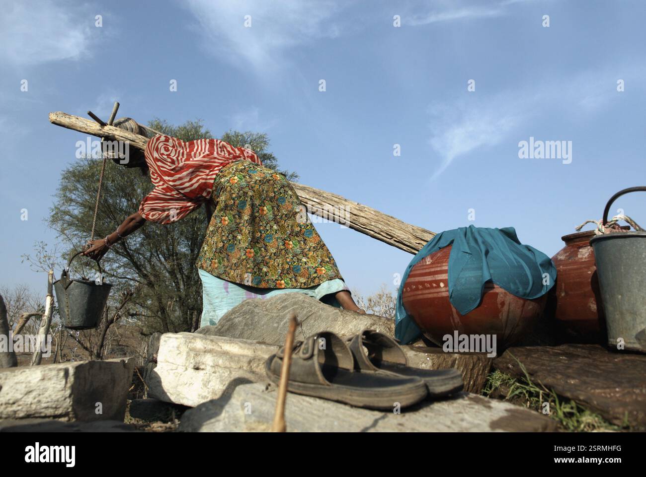Rajasthani lady fetch drinking water from well, Rajasthan, India, Asia ...