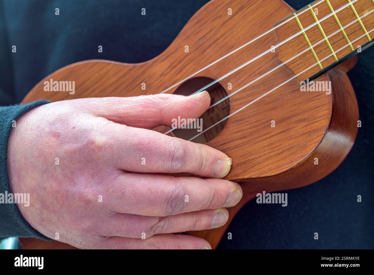 male playing on ukulele Stock Photo - Alamy