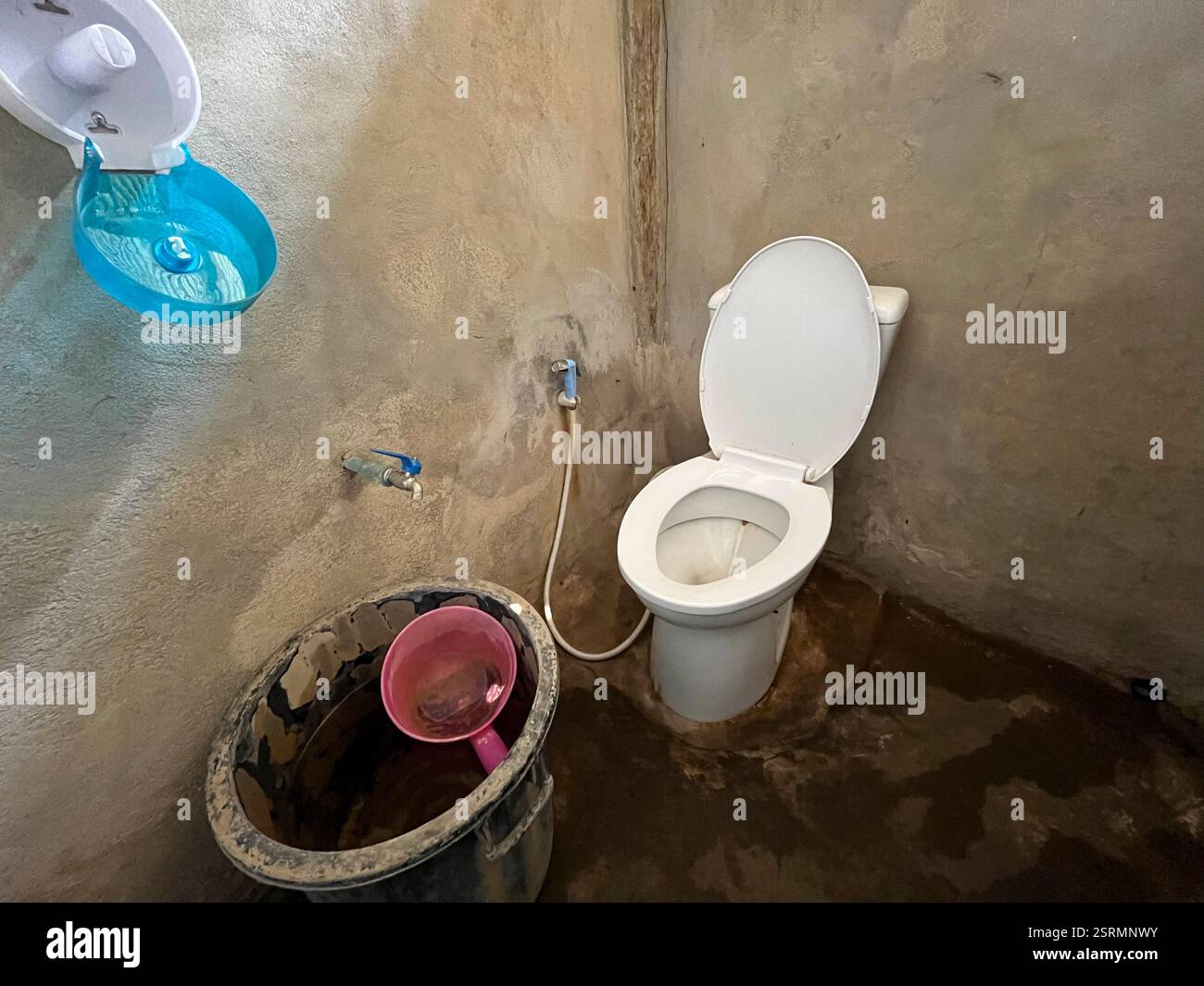 Very simple western style water toilet in rural Northern Thailand Stock ...