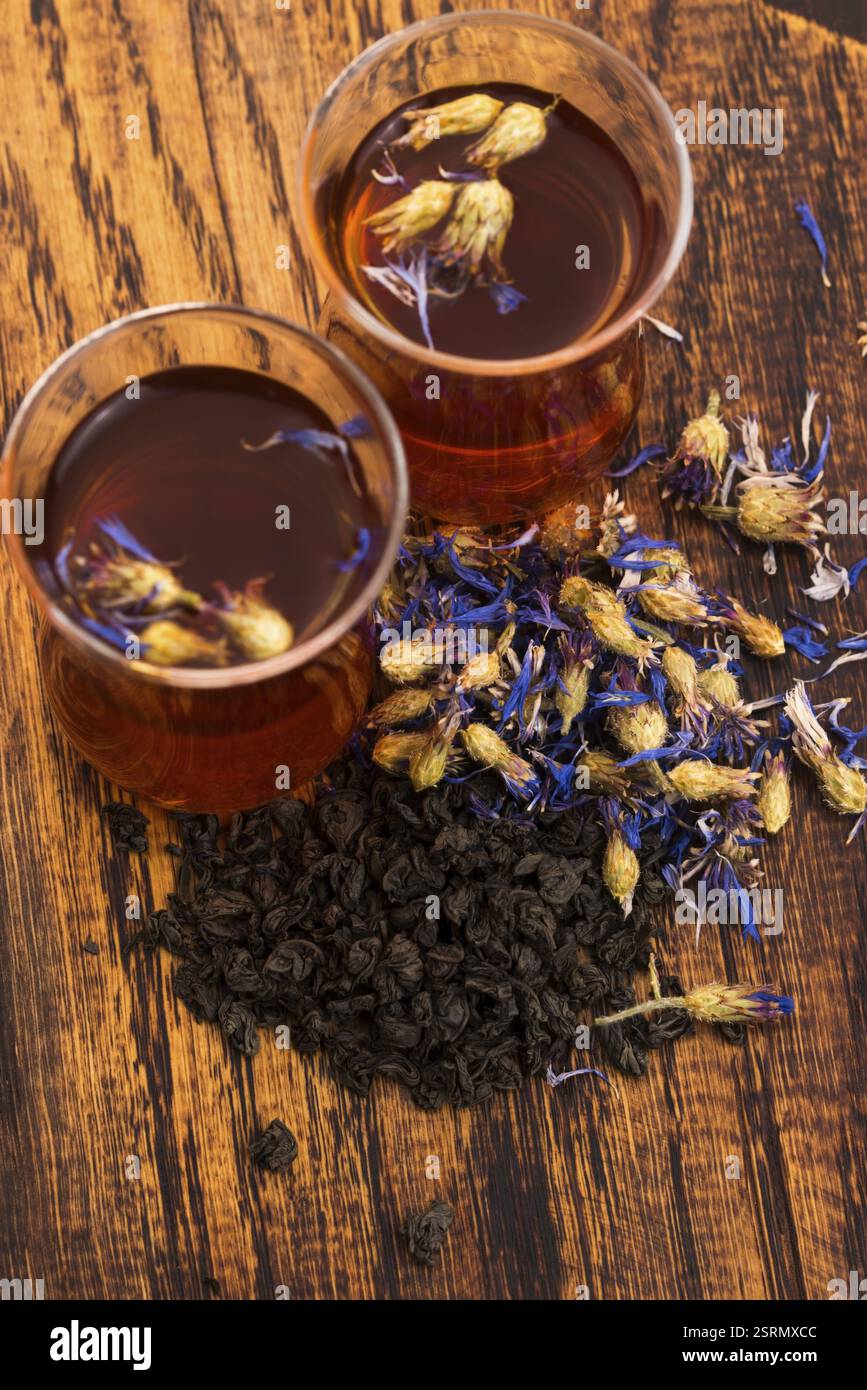 Glass cup with a cornflower tea Stock Photo - Alamy