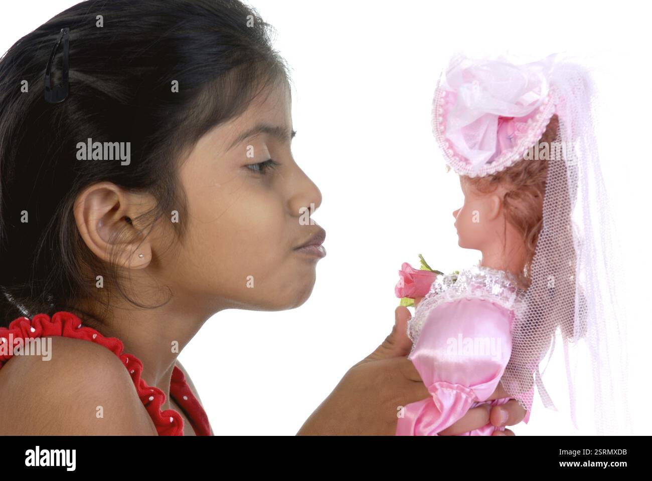 Girl love with Barbie doll looking at each other on white background MR ...