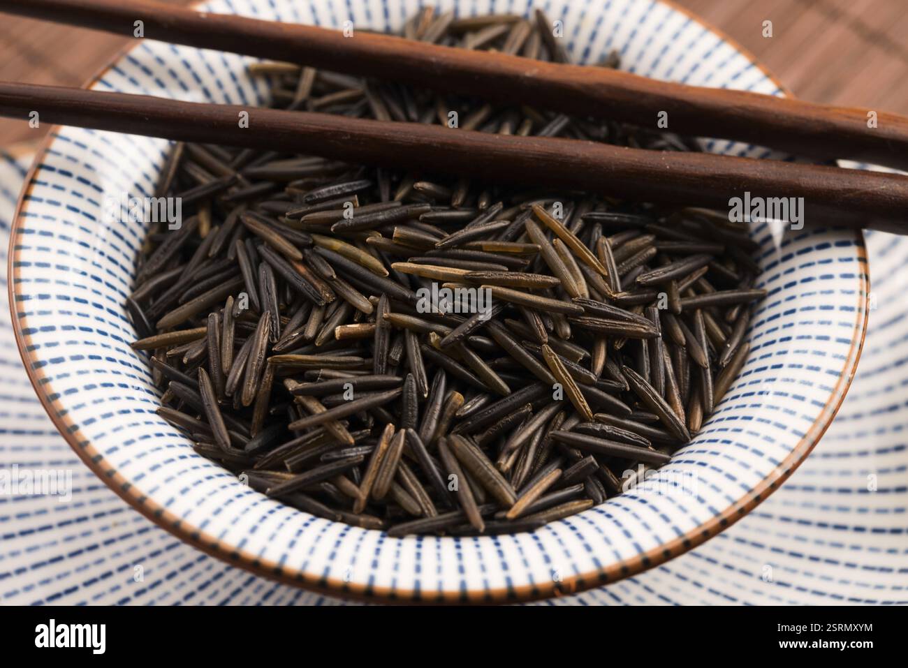 Wild rice in a white ceramic bowl Stock Photo - Alamy