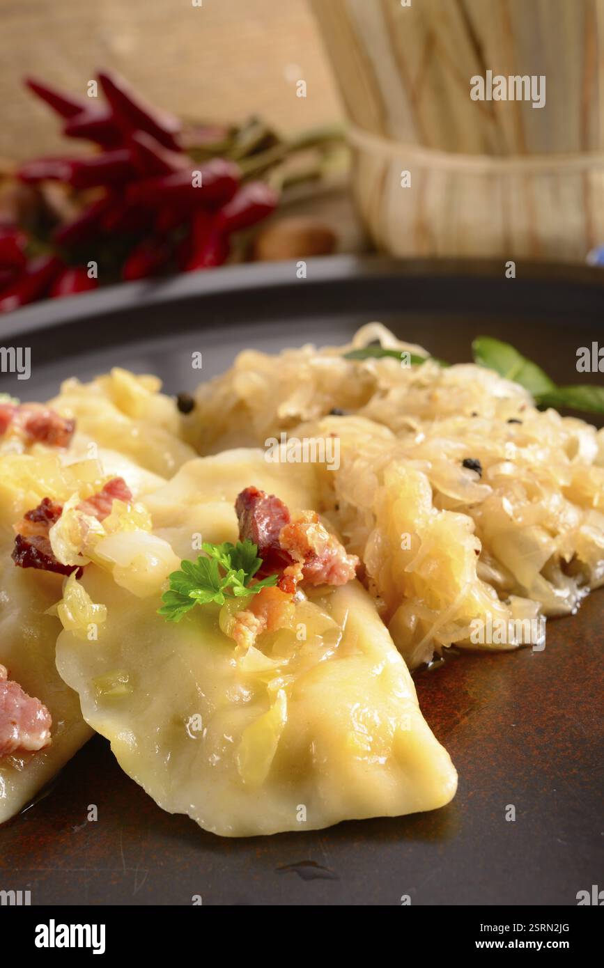 Pierogi.Polish dish pierogi with sauerkraut and mushrooms Stock Photo ...