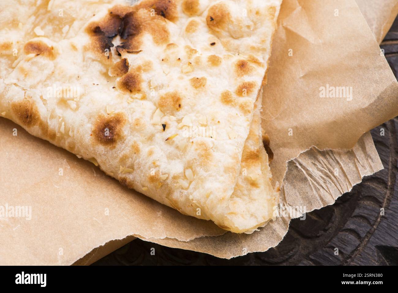 Garlic Naan, Indian flat bread Stock Photo - Alamy