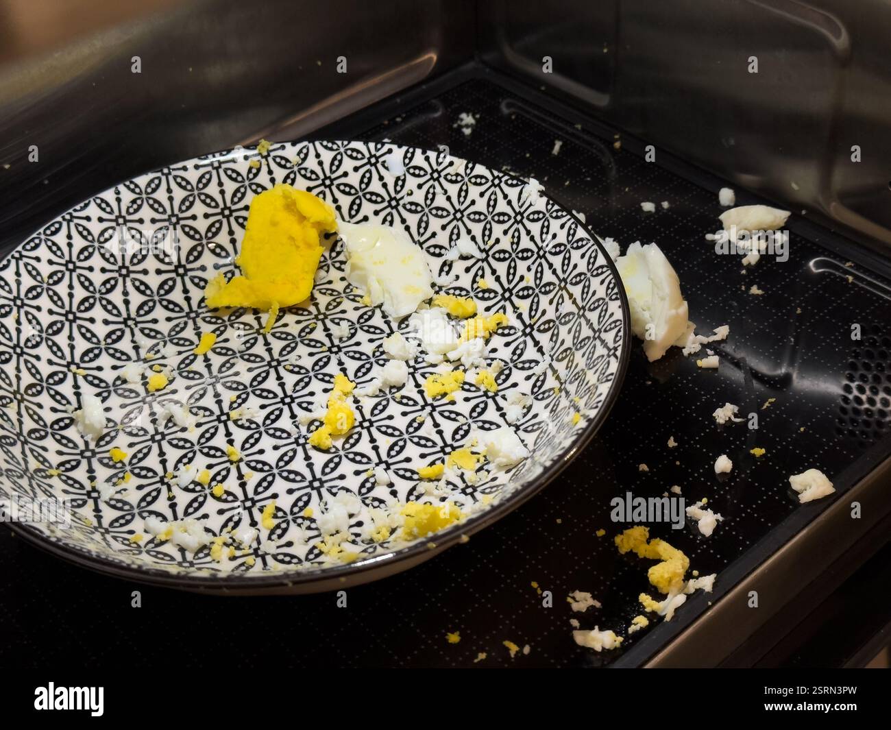 Exploded egg in microwave, cleaning concept and food safety awareness ...