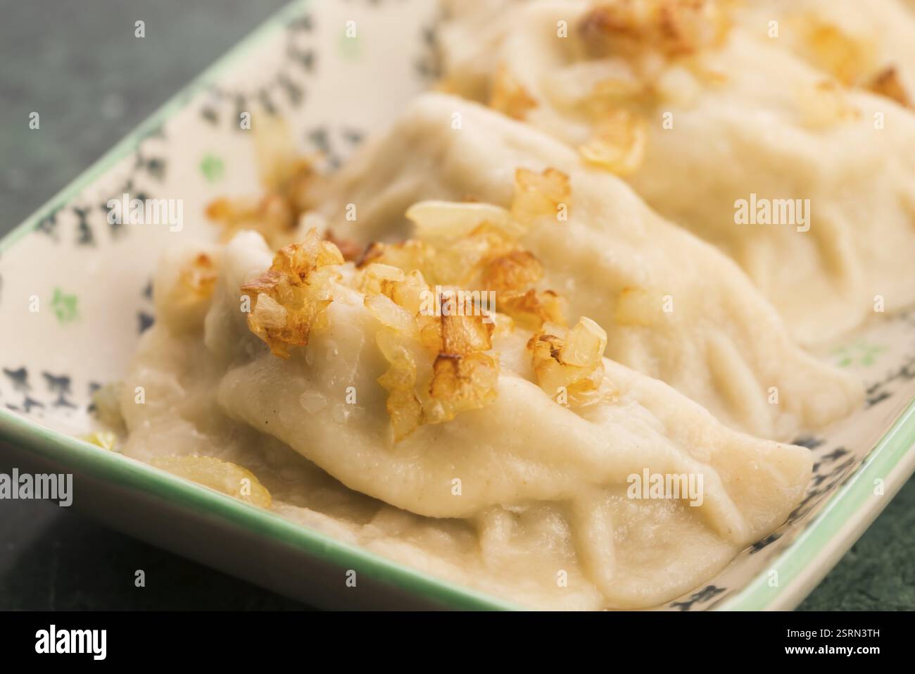 Polish pierogi filled with cabbage and mushrooms Stock Photo - Alamy