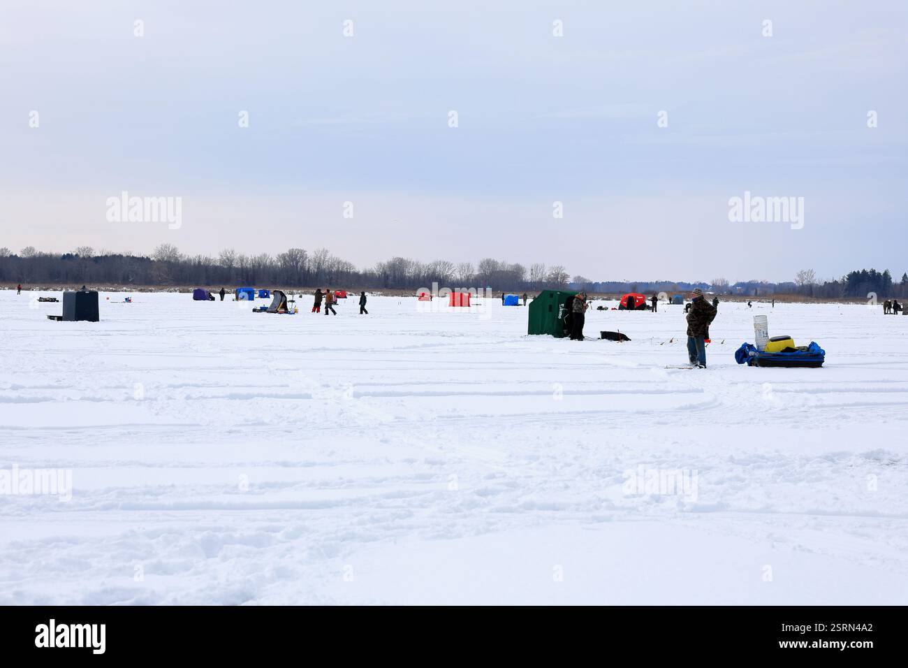 Greece, NY, USA - January 25th 2025 - Ice fishermen fishing through the ...