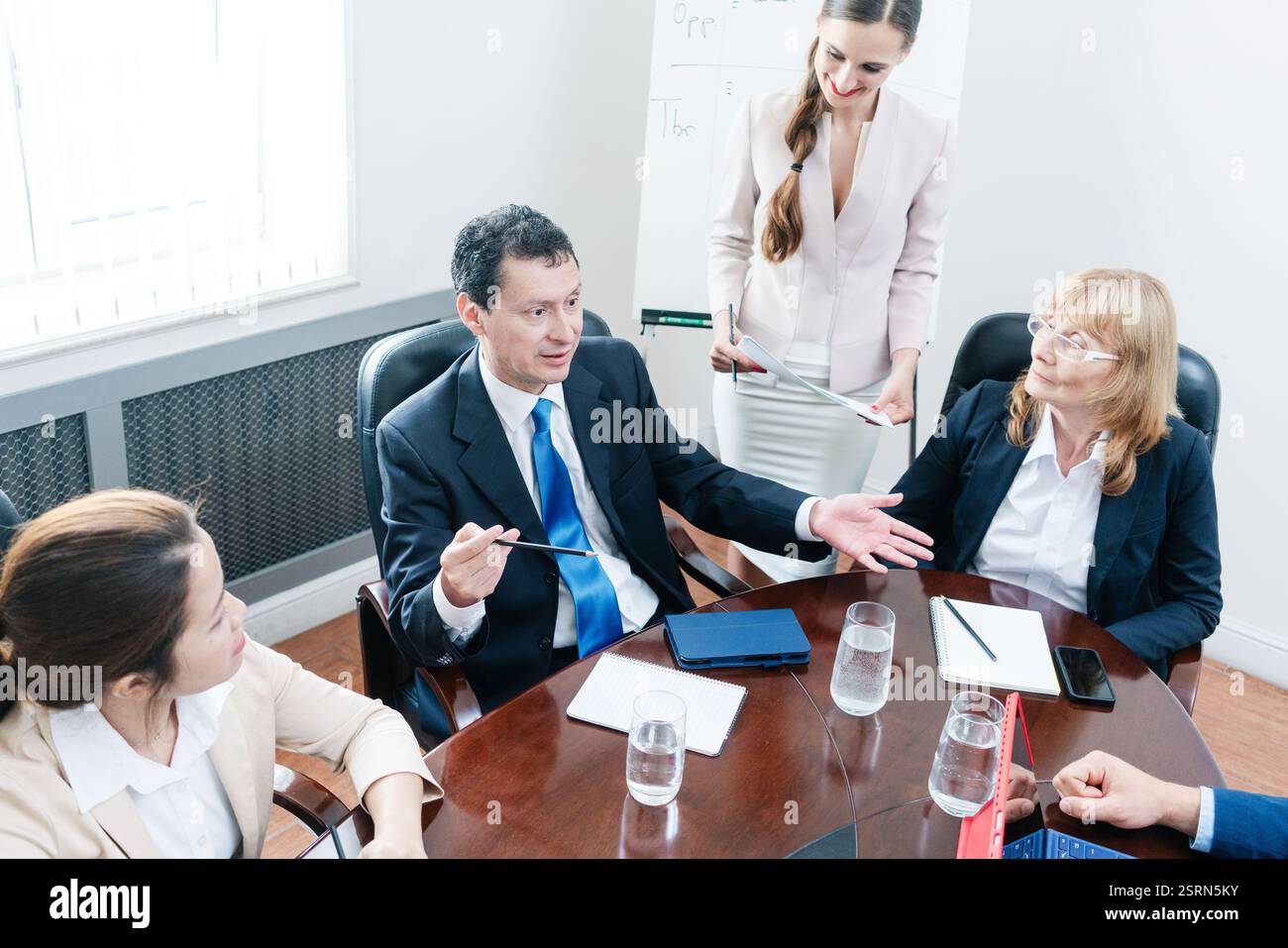 manager sharing his opinion while interpreting a pie-chart during board ...