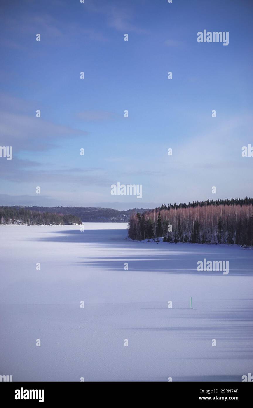 Winter landscape with frozen lake scenery Stock Photo - Alamy