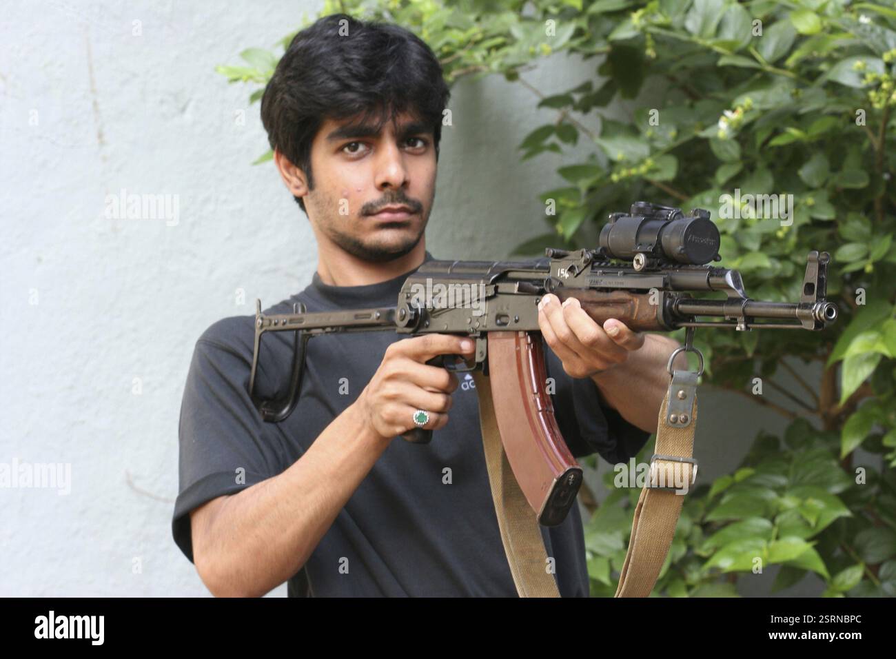 A young man with an AK 47 light machine gun MR Stock Photo - Alamy