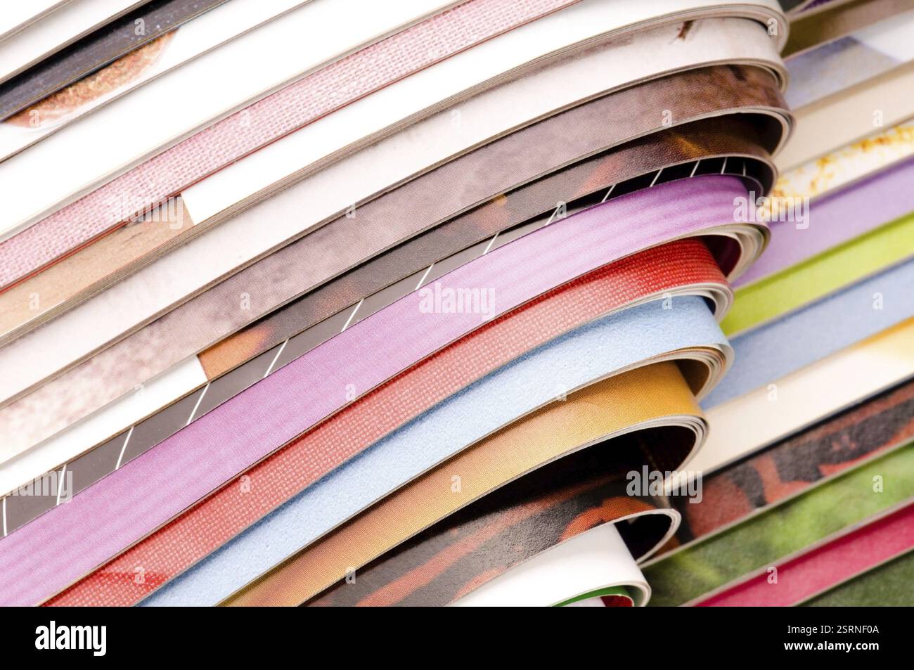 Stack of open magazines Stock Photo - Alamy