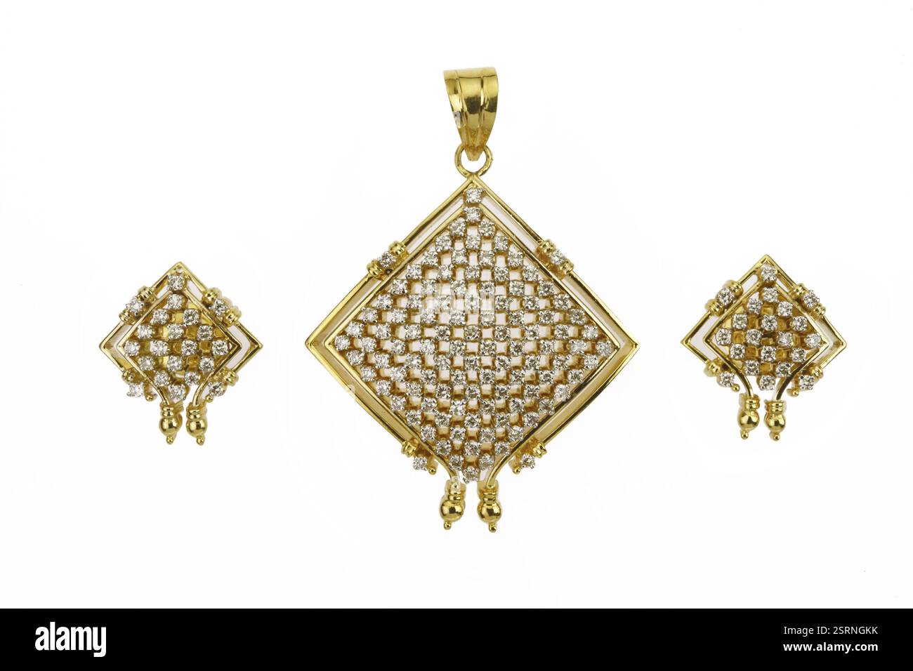Diamond with gold jewellery pendent with ear tops on white background ...