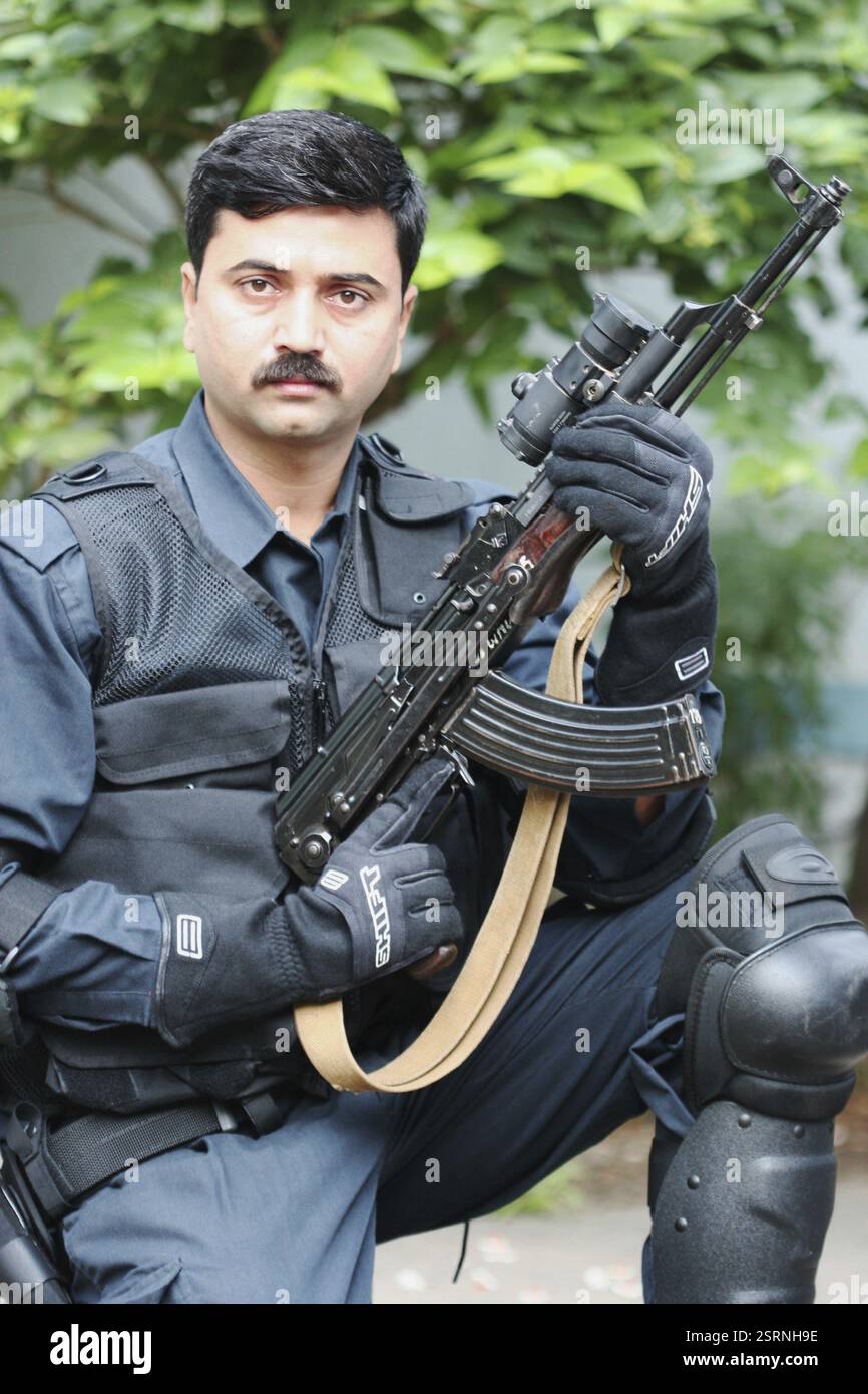 Black Cat commando with an AK 47 light machine gun MR#725 Stock Photo ...