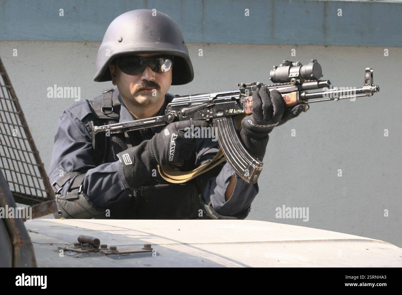 Black Cat commando with an AK 47 light machine gun MR#725 Stock Photo ...