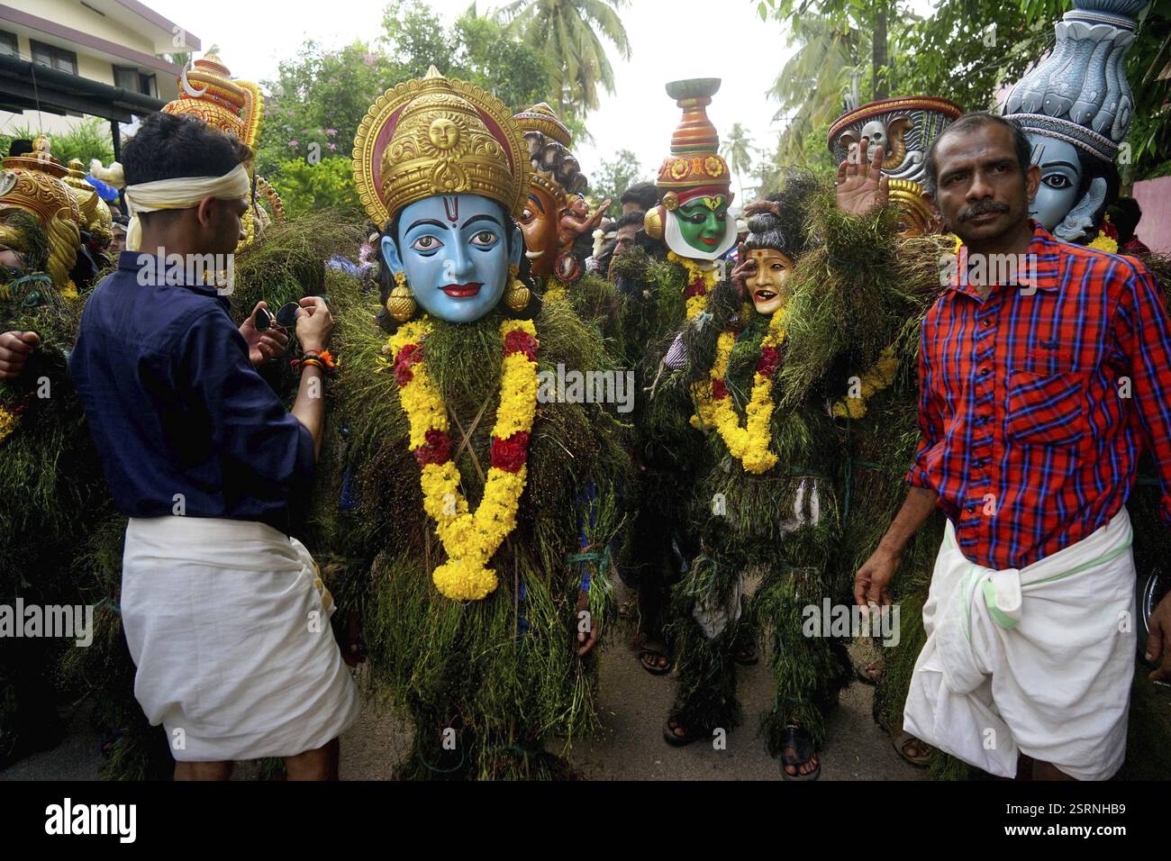 Traditional Kummatti dancers wear colourful wooden masks gods Kummatti ...