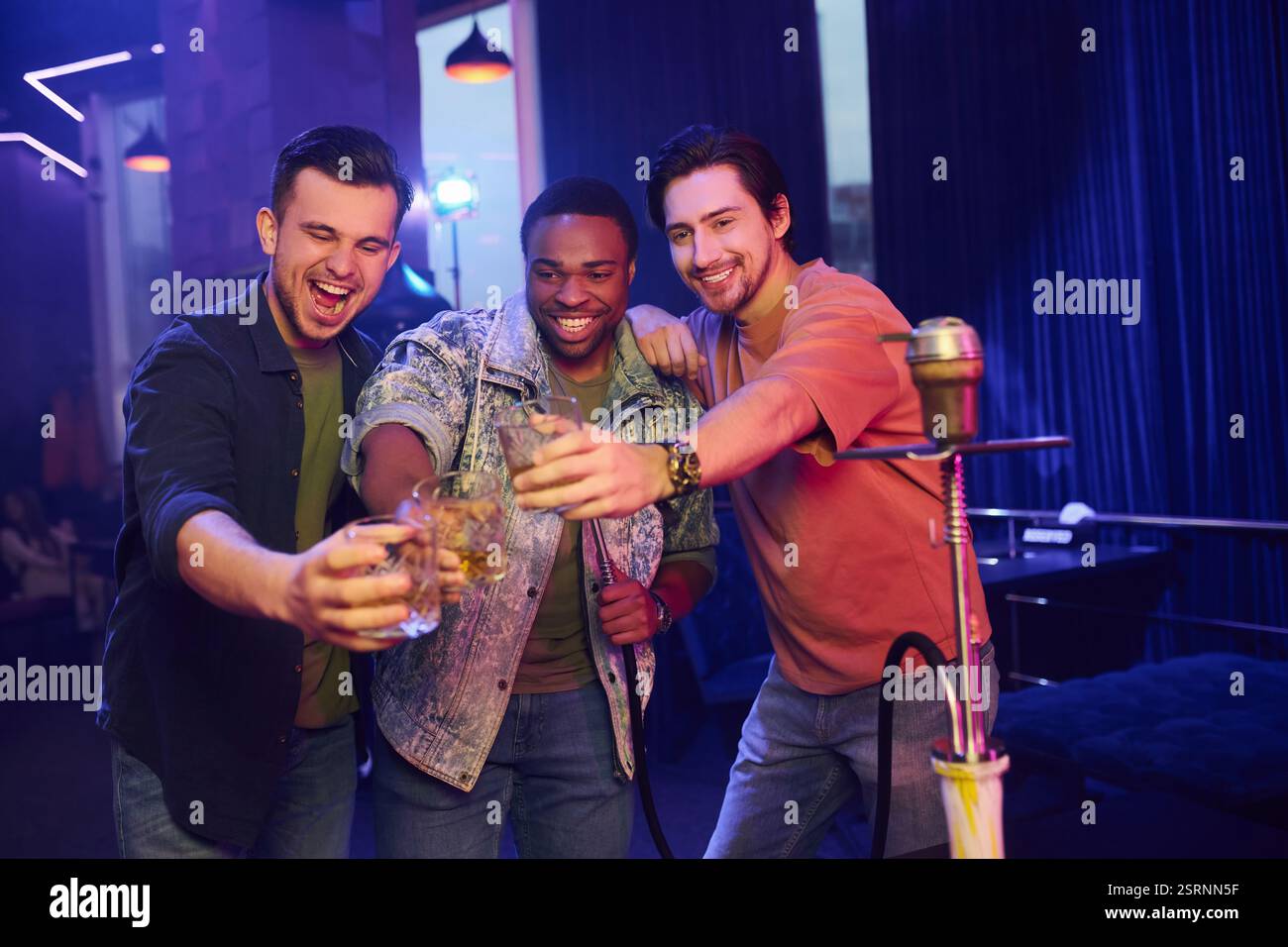 Partying all night long. Group of friends having fun in the night club ...