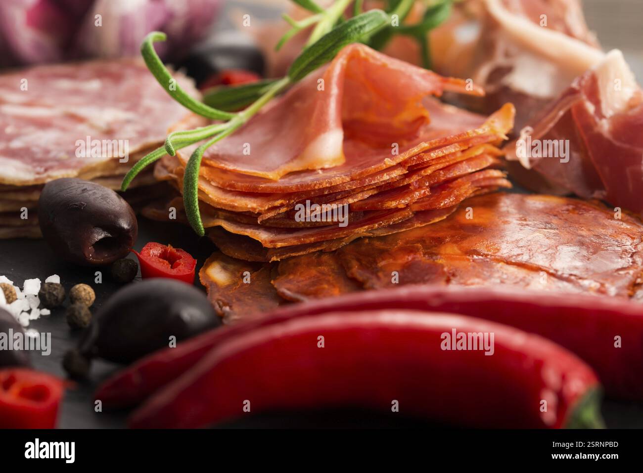 A pile of different spanish embutido, jamon, chorizo and lomo embuchado ...