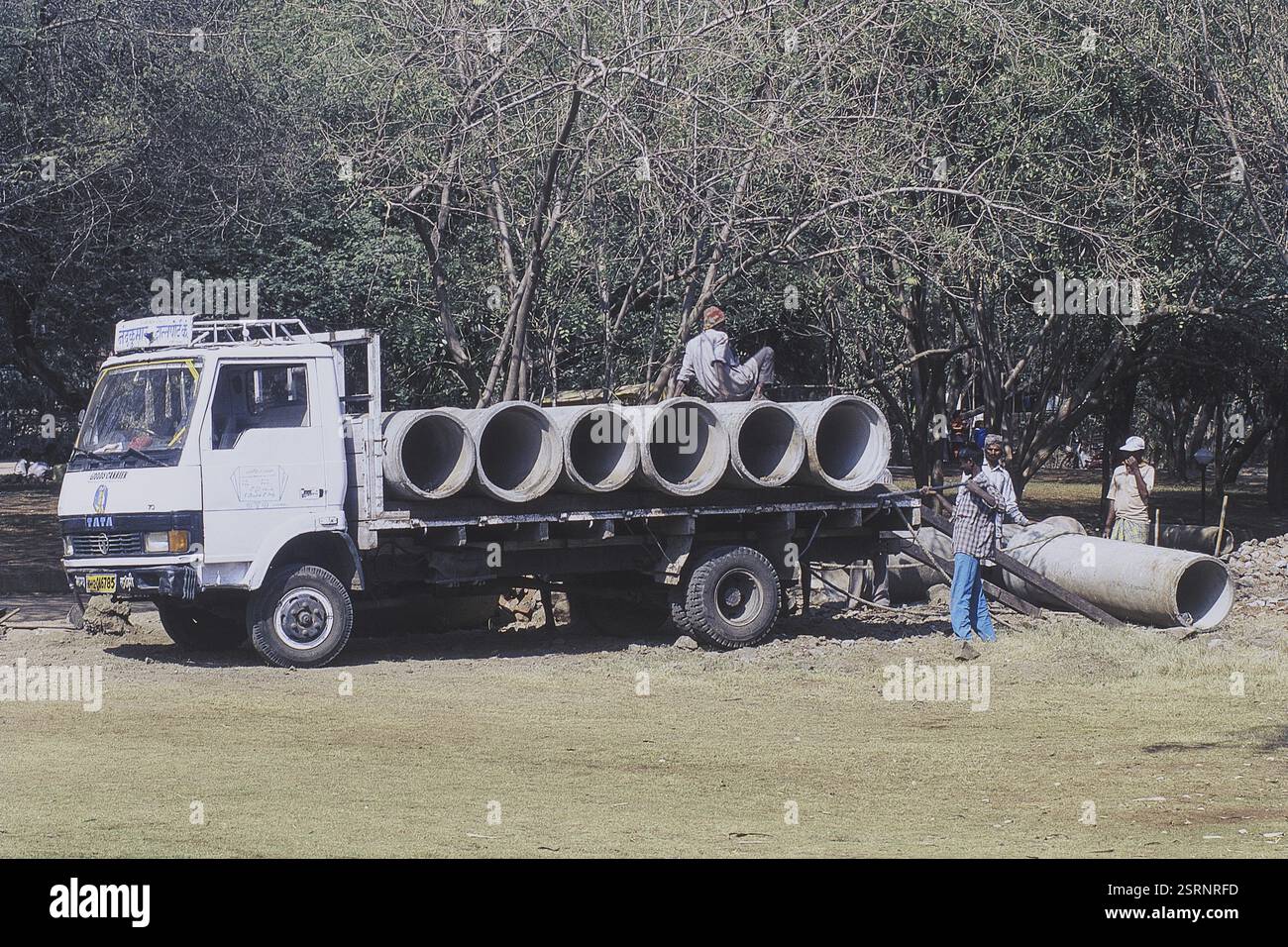 Workers loading pipes on Tata truck, Pune, Maharashtra, India, Asia ...