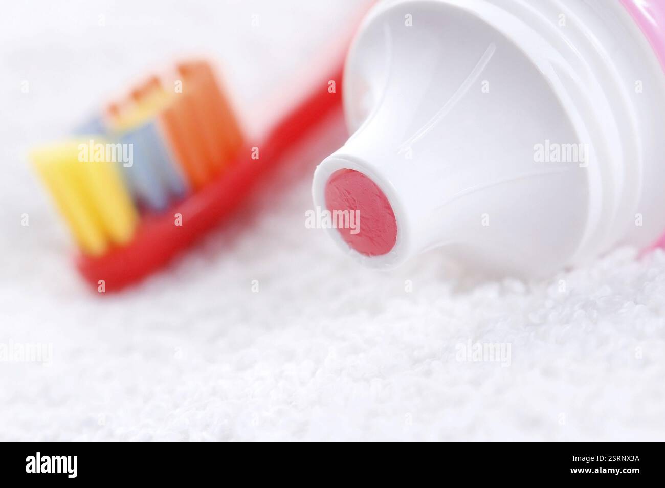 Toothbrush and strawberry tooth paste Stock Photo - Alamy