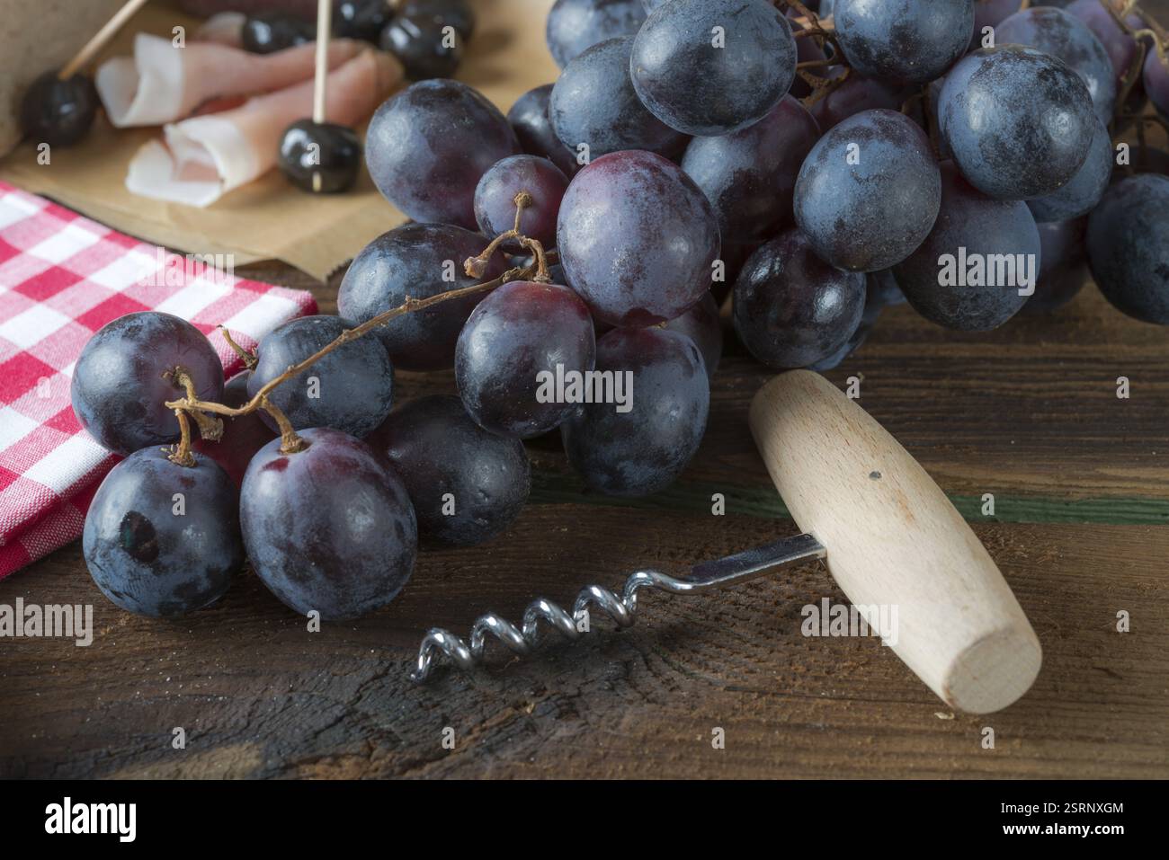 Ham to olive bunches of grapes Stock Photo - Alamy