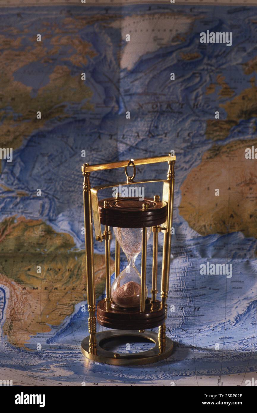 Sand clock time hour glass on map Stock Photo - Alamy