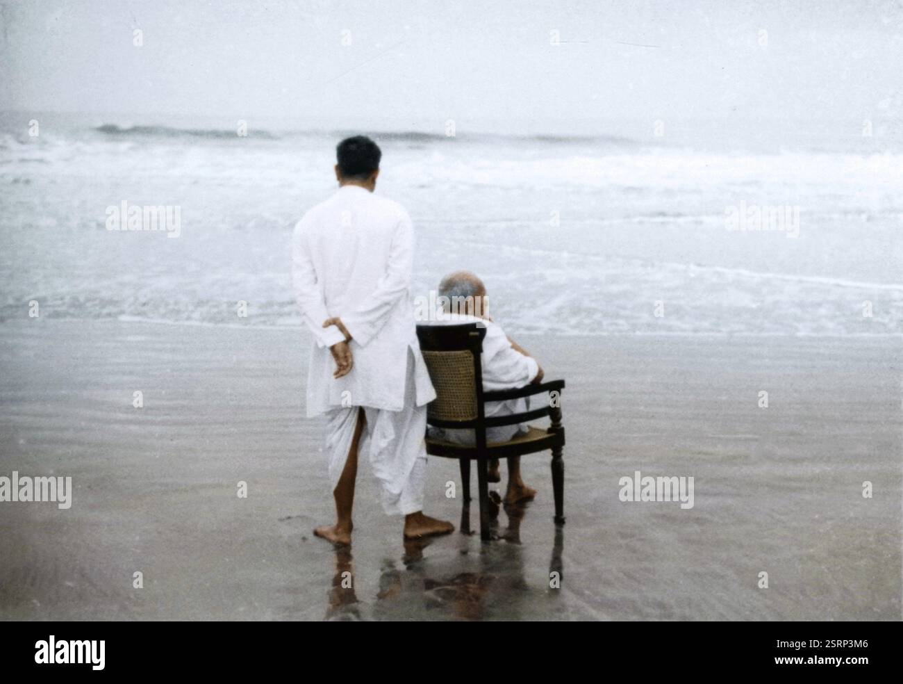 Mahatma Gandhi sitting on chair and Devdas Gandhi on Juhu Beach, Mumbai ...