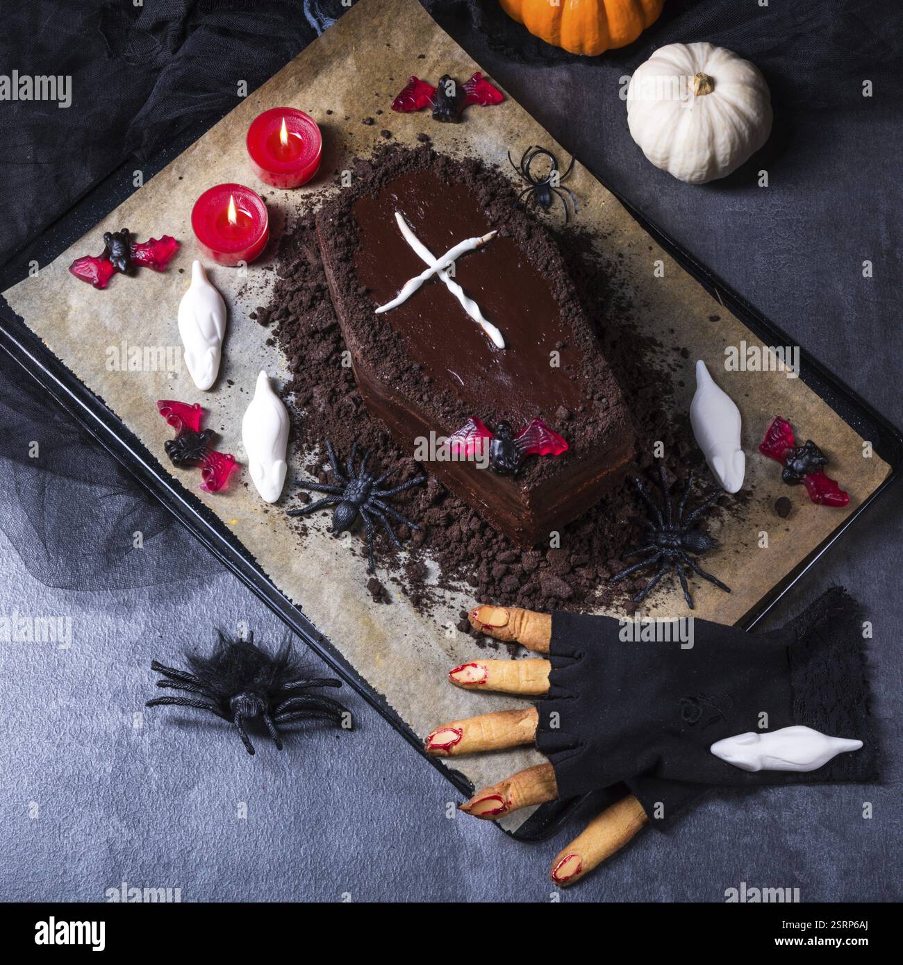 Halloween biscuit finger and cake coffin Stock Photo - Alamy
