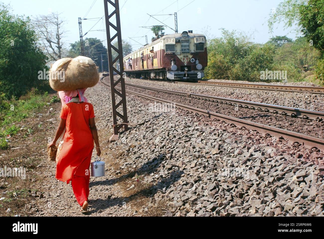 E.M.U local train on track in village side, Calcutta Kolkata, West ...