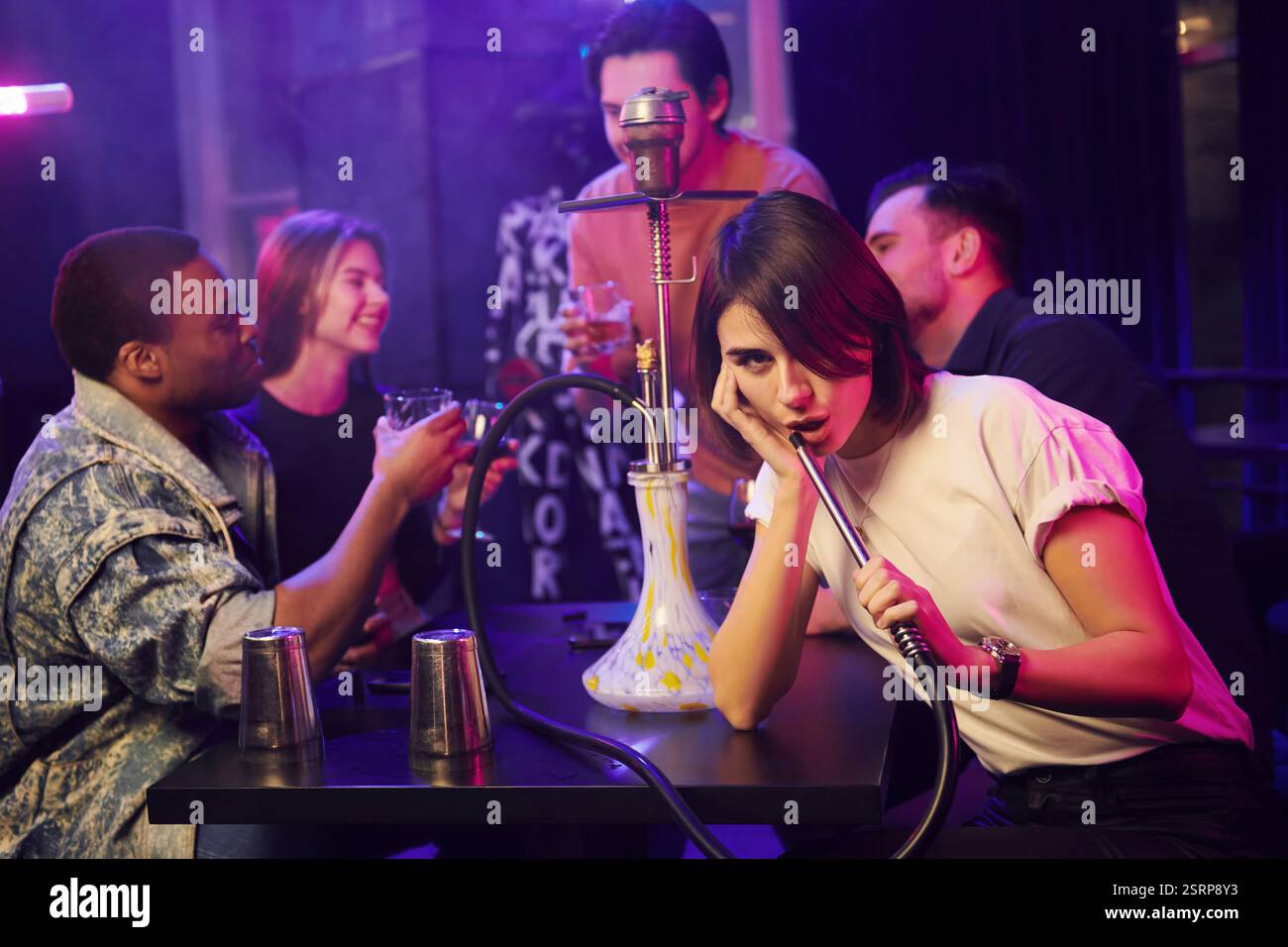 Beautiful young women smoking club hi-res stock photography and images ...
