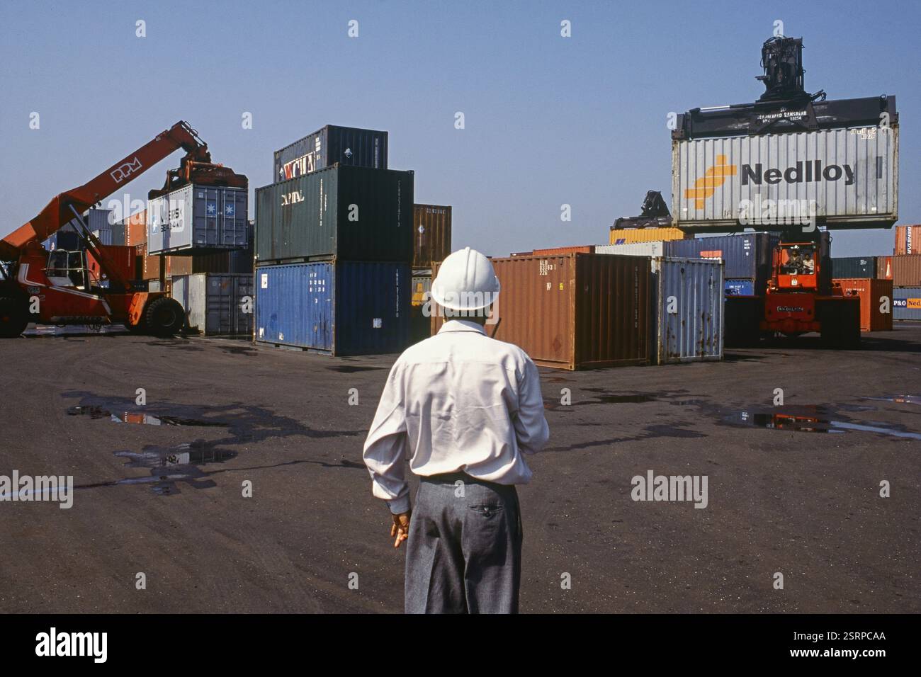 Stacking containers at JNPT container yard, Nhava Sheva, Navi Mumbai ...